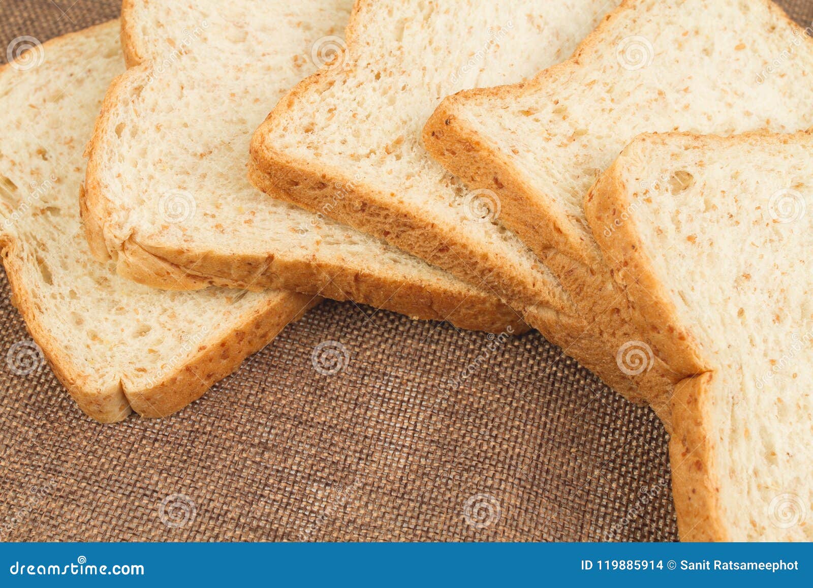 Pile Slice of Whole Wheat Bread on Dark Brown Calico. Stock Photo ...
