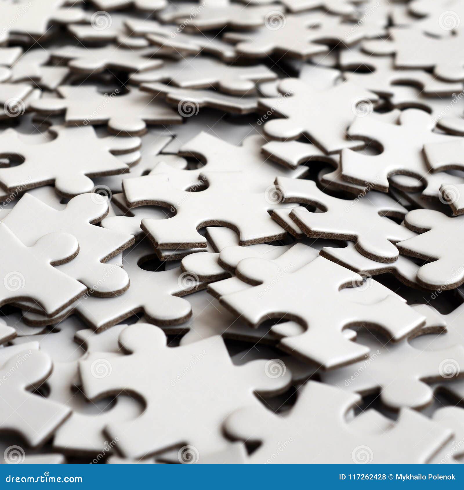 Close-up of a Pile of Uncompleted Elements of a White Puzzle. a Huge ...