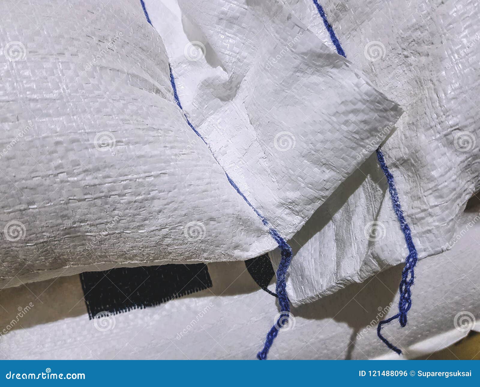 Close-up Pile of White Plastic Sacks with Blue Threads Stock Photo ...