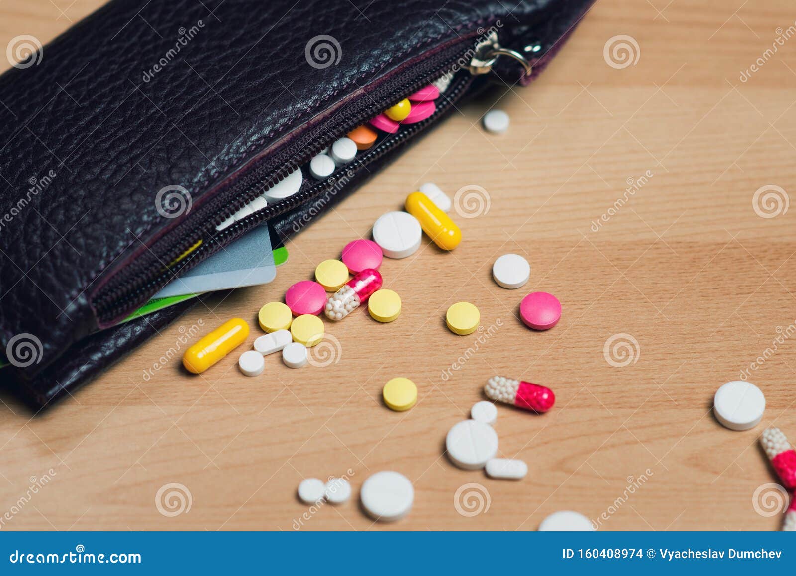 Pills on the Table and Wallet from Which the Tablets Fall Stock Photo ...