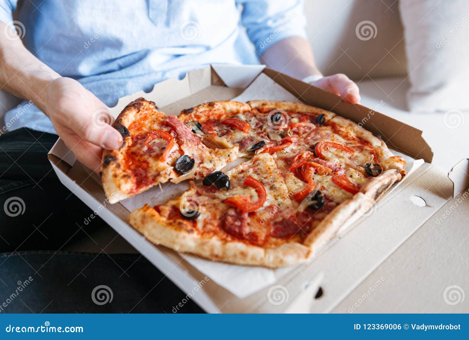 Close Up of a Pizza in Box on Men`s Lap Stock Photo - Image of hand ...
