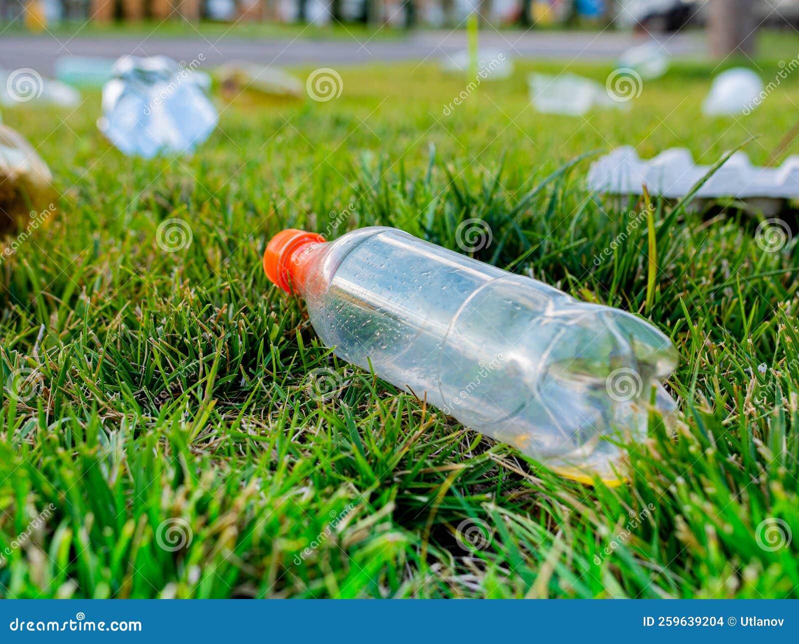 Empty Plastic Bottles Thrown on the Grass. Garbage Collection on the ...