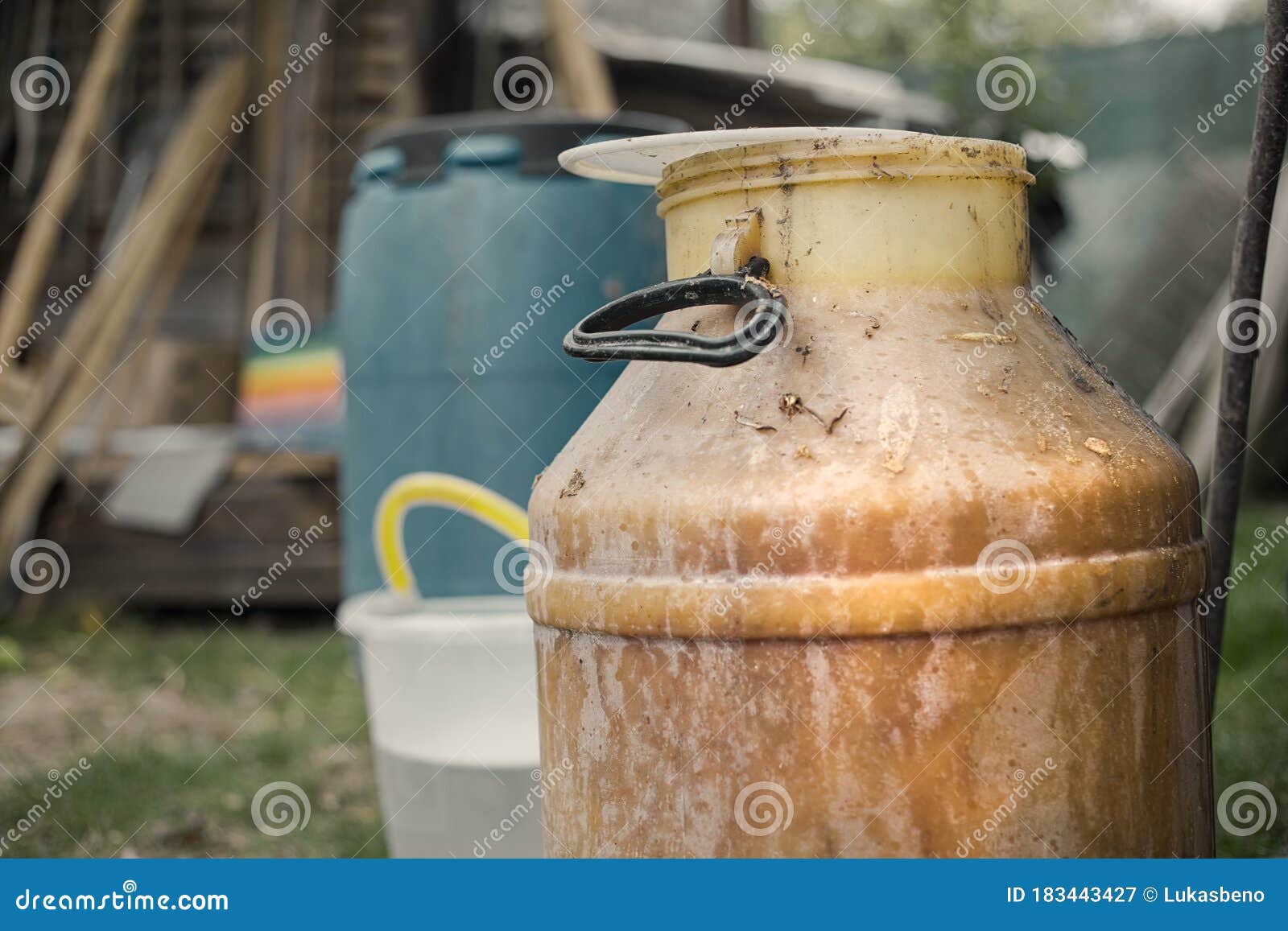 Close Up of Plastic Container for Liquid in the Garden. Old Dirty Water ...