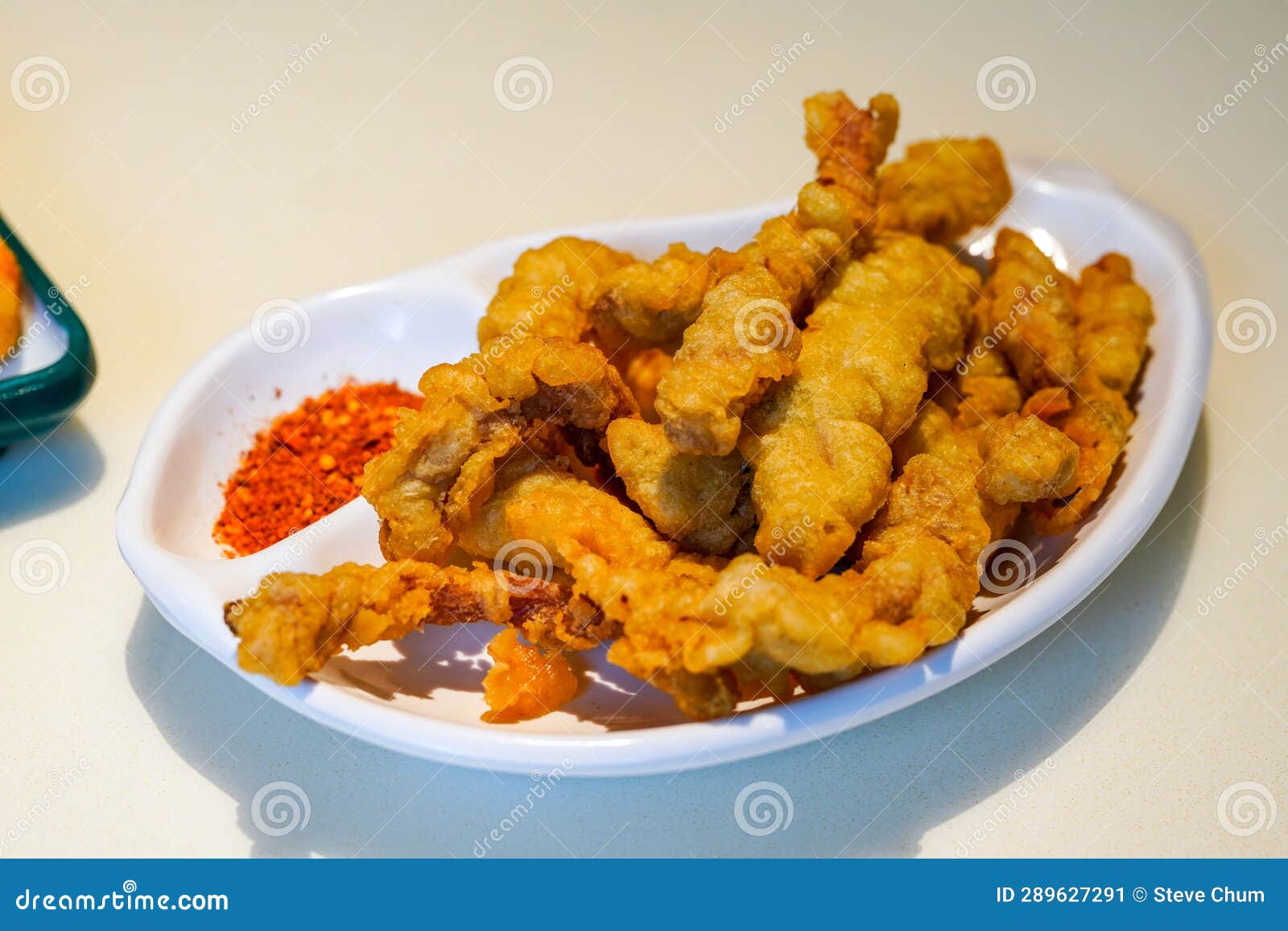 Close-up of a Plate of Delicious Little Crispy Meat Stock Image - Image ...
