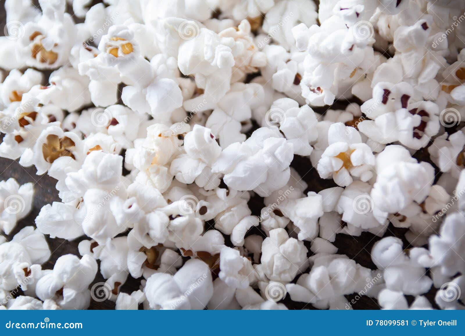 Close Up of Popcorn Spilled Out on a Wooden Table with Selective Stock ...