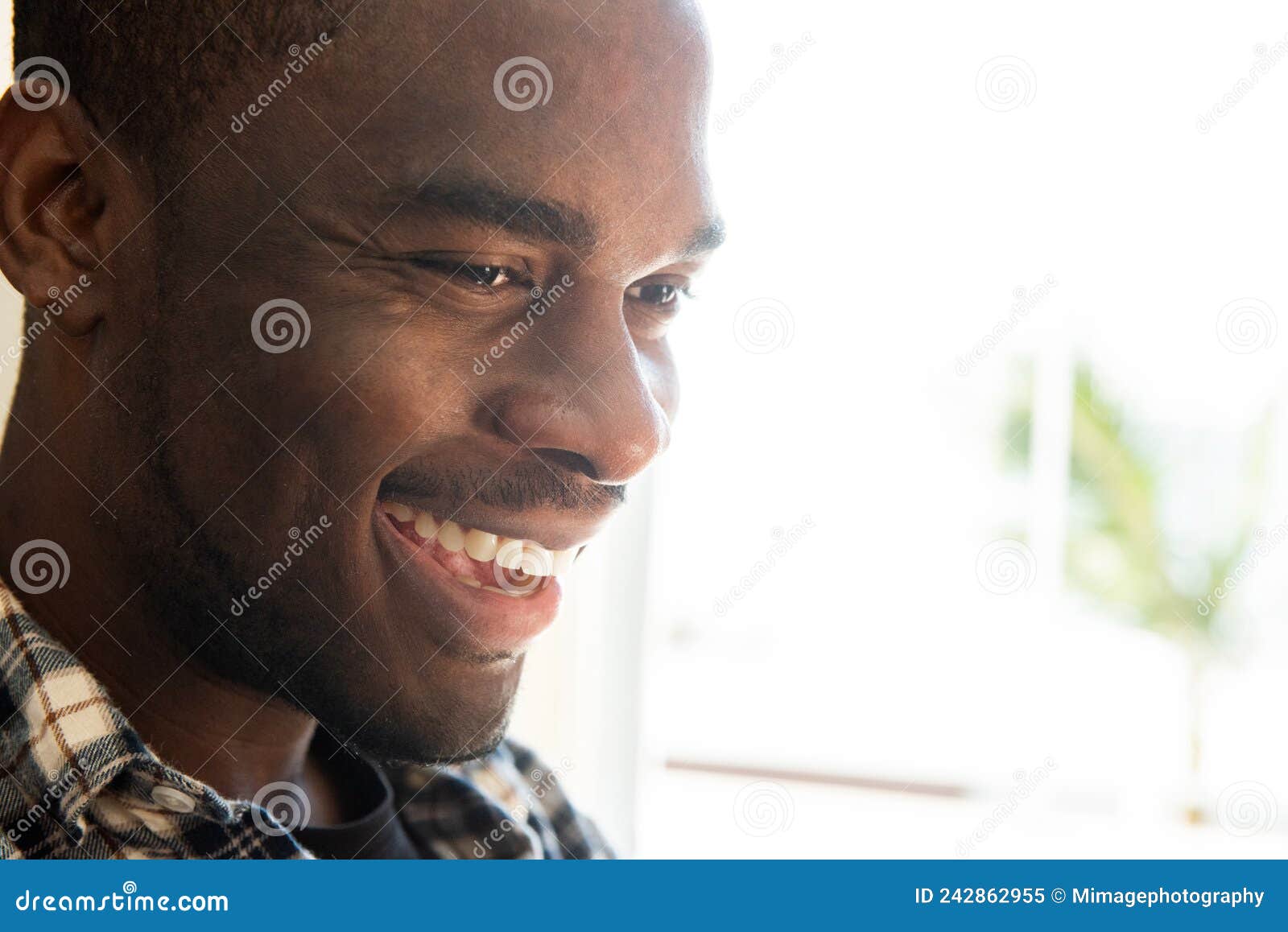 Close Up Portrait African American Man Laughing And Looking Away Stock