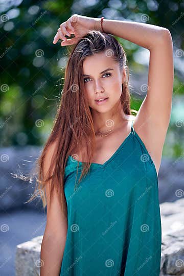 Close Up Portrait Of Beautiful Girl In A Green Dress Stock Image