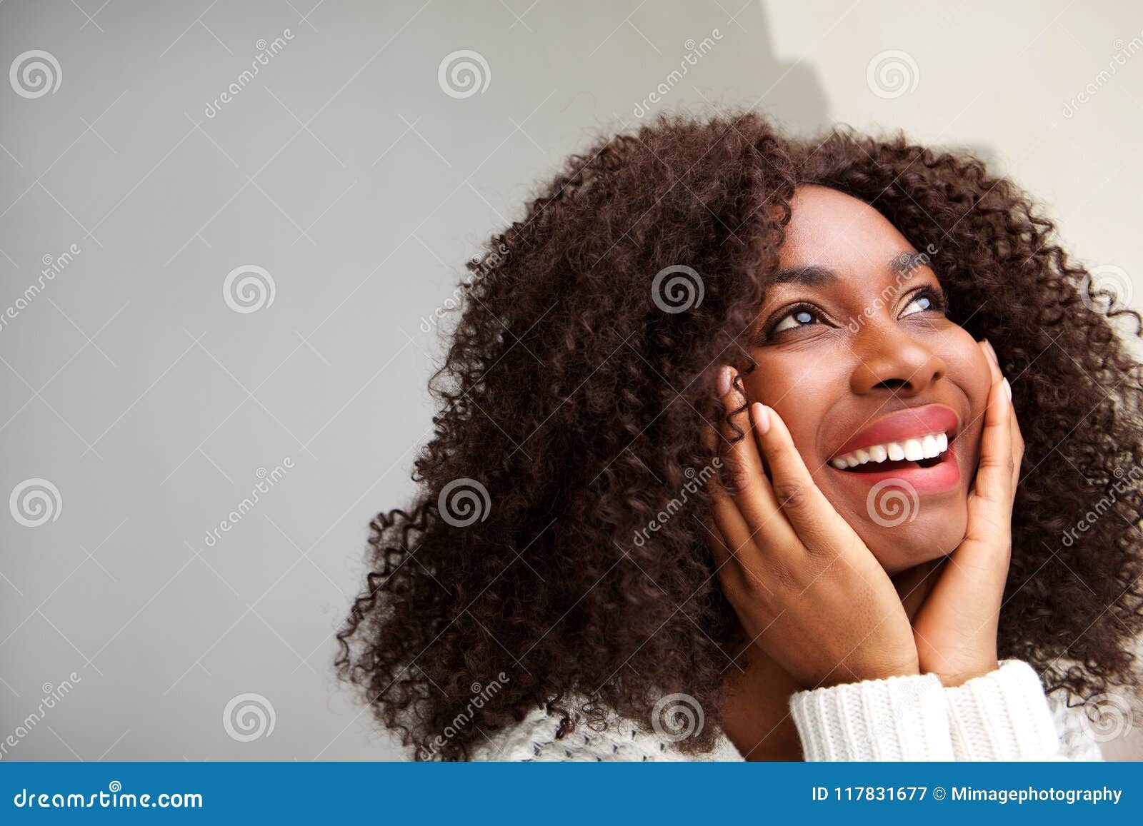 Close Up Beautiful Young African Woman With Curly Hair Looking Away