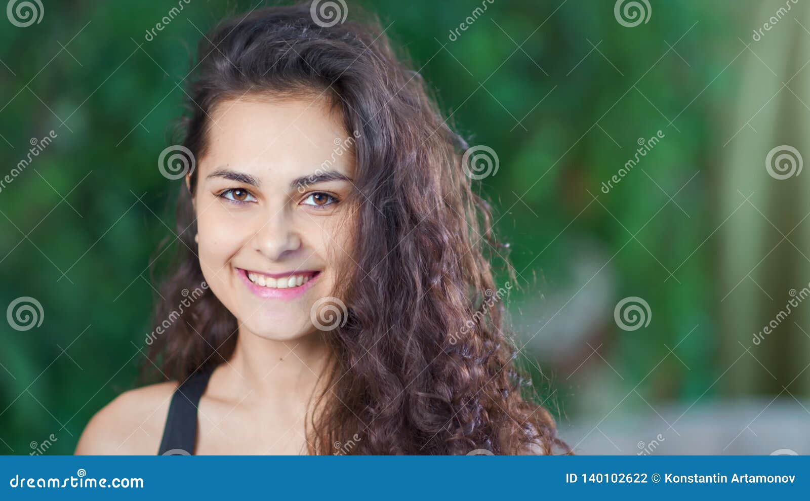 Close Up Portrait Of Beautiful Young Caucasian Girl Smiling And Looking