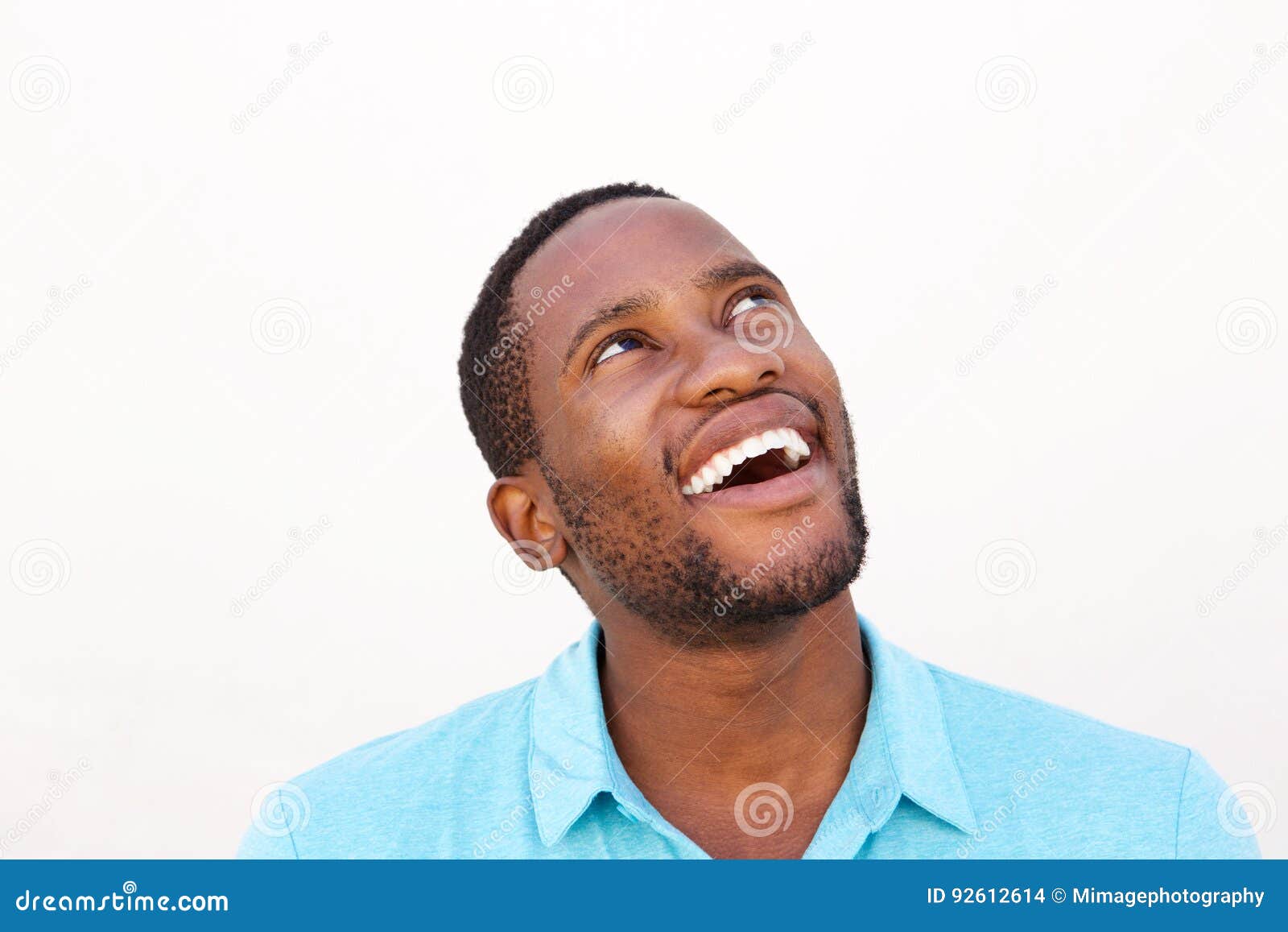 Cheerful Young African Man Looking Away and Smiling Stock Photo - Image ... Cheerful Young African Man Looking Away and Smiling Stock Photo - Image ...