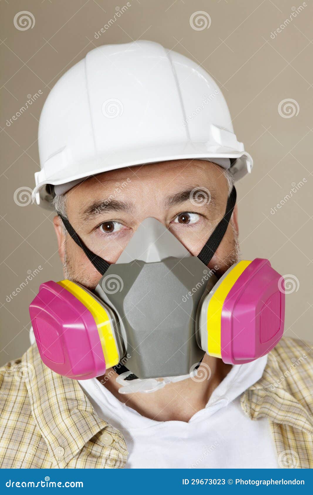 Close-up Portrait of Contractor with Dust Mask Over Colored Background ...