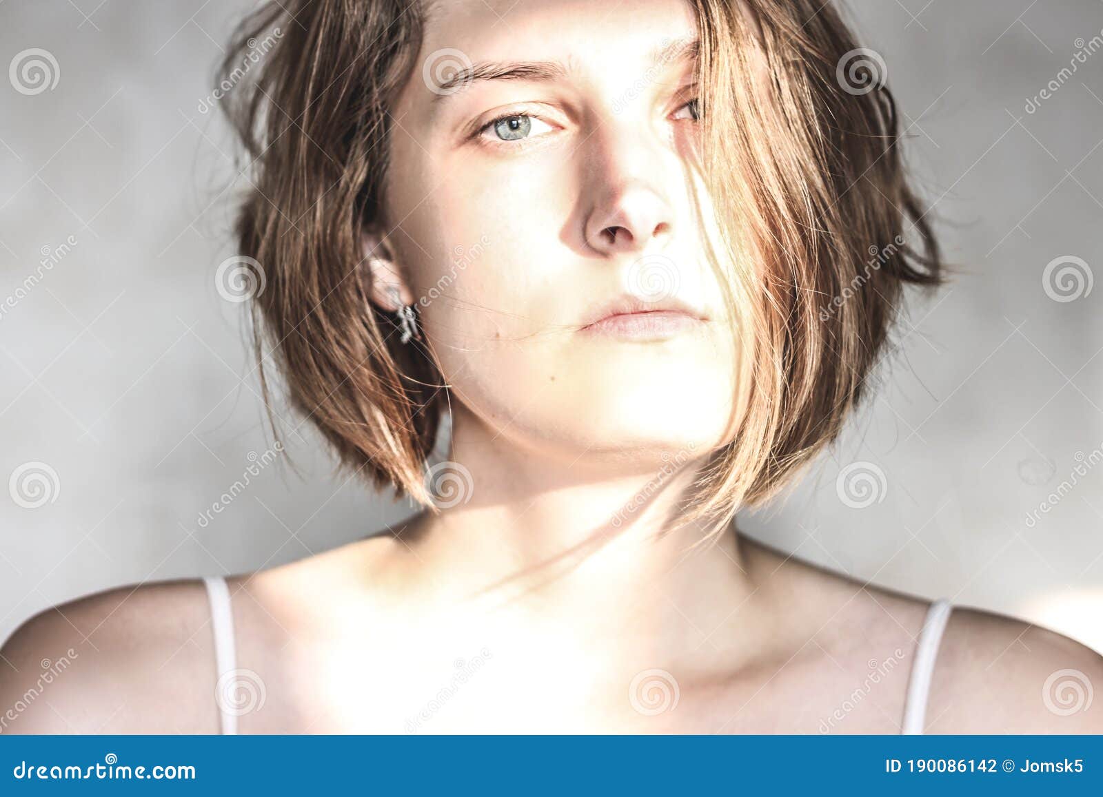 Close-up Portrait of a Girl`s Face. Ray of Light on the Face Stock ...
