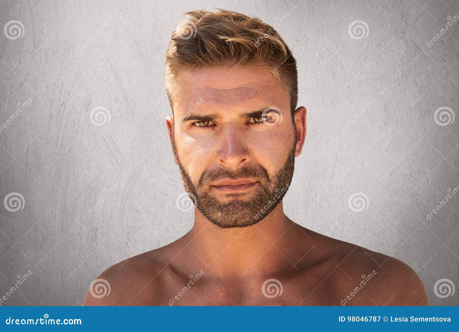 Close Up Portrait Of Good Looking Male With Dark Eyes Bristle And