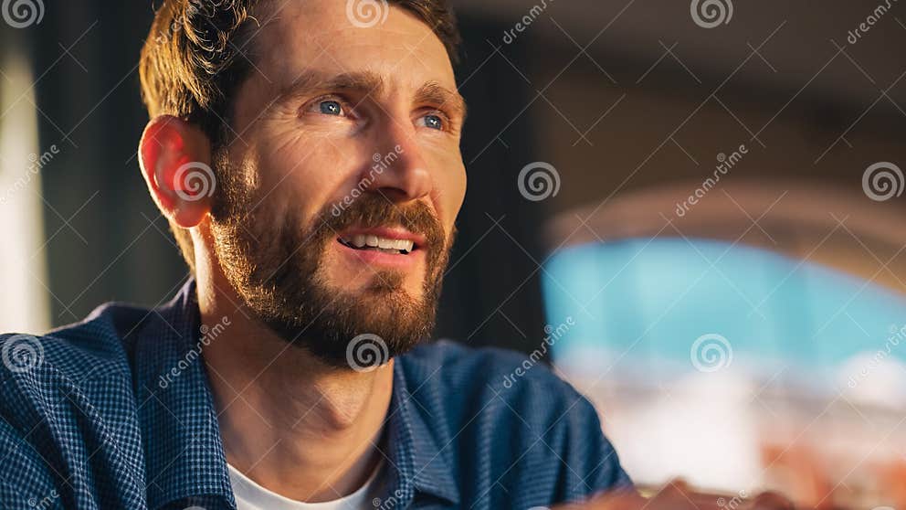 Close Up Portrait Of Handsome Man Spending Time At Home Sitting On A