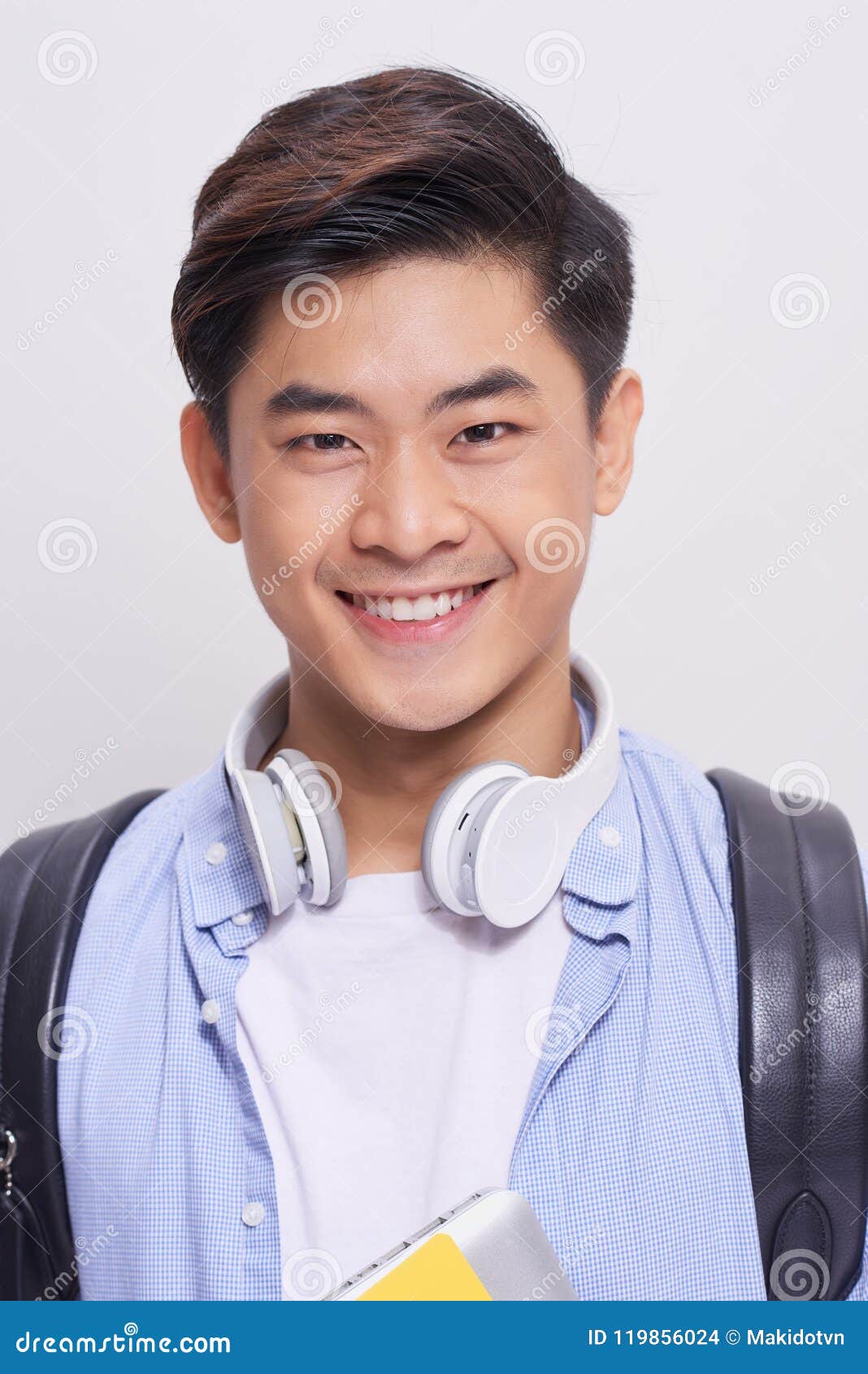 Close Up Portrait Of A Handsome Young Asian Man Smiling On Isolated ... Close Up Portrait Of A Handsome Young Asian Man Smiling On Isolated ...