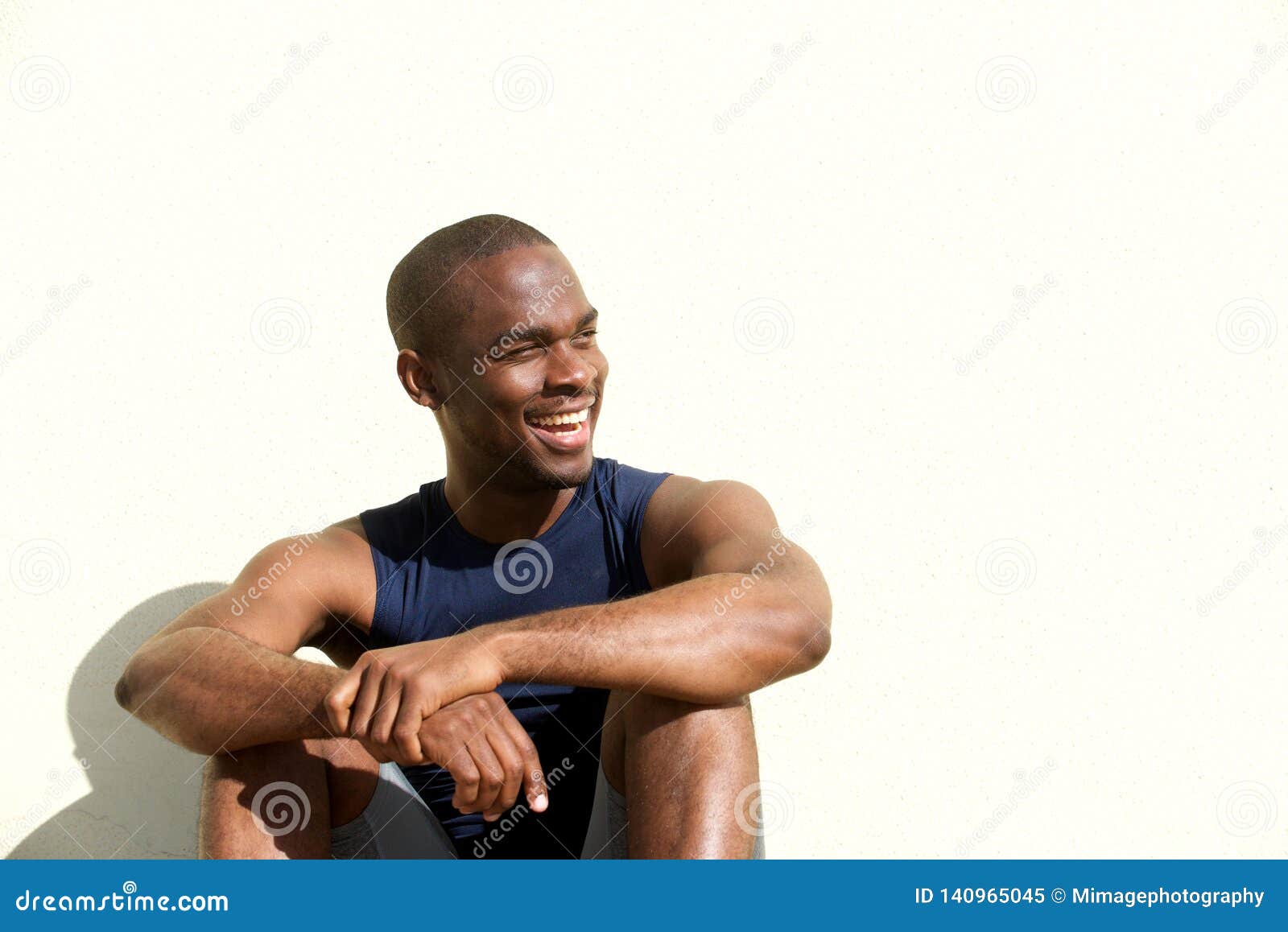 Close Up Handsome Young Black Man Sitting by Wall Outdoors Stock Image ... Close Up Handsome Young Black Man Sitting by Wall Outdoors Stock Image ...