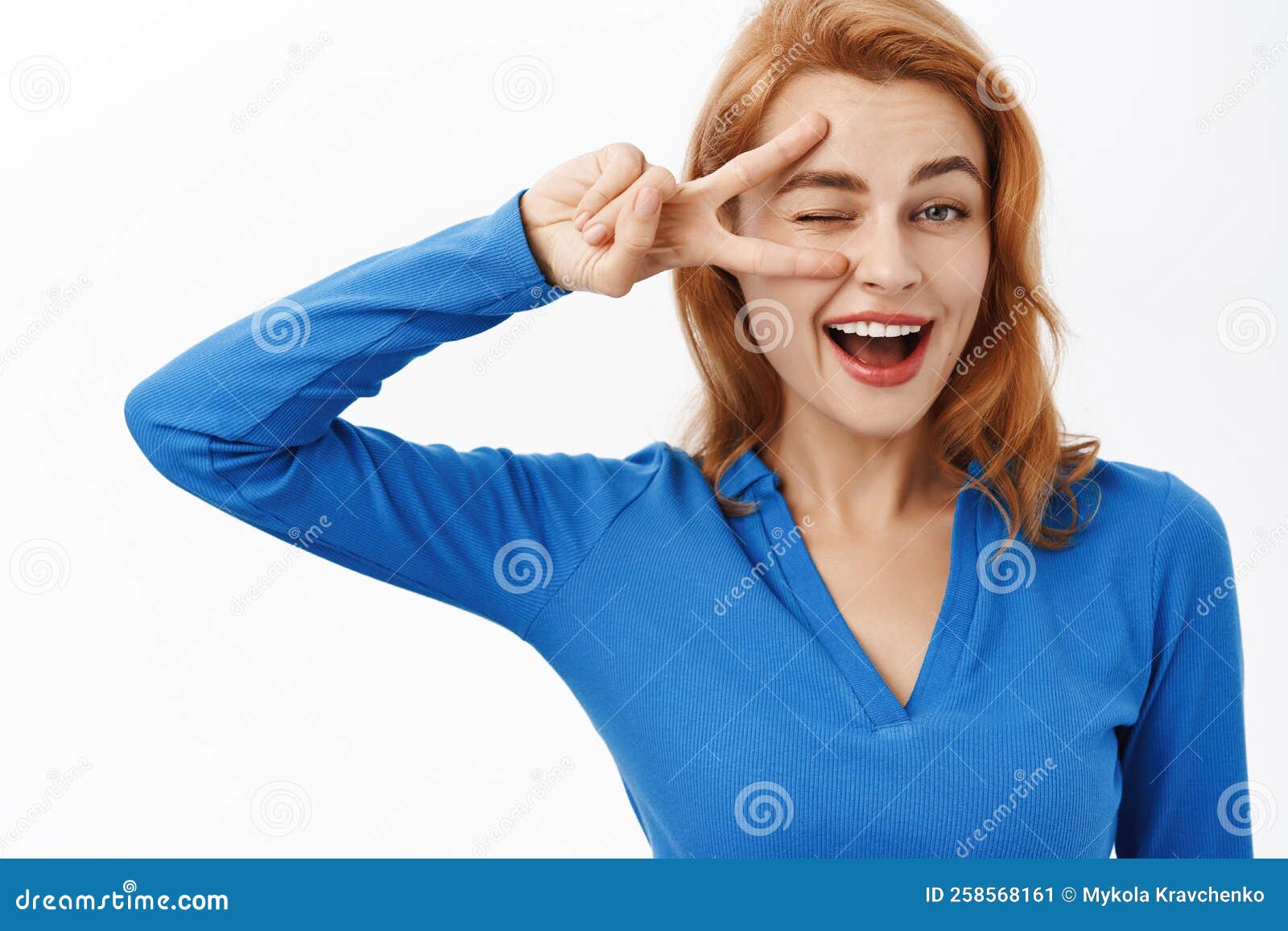 Close Up Portrait Of Healthy Happy Woman Showing Peace V Sign Gesture