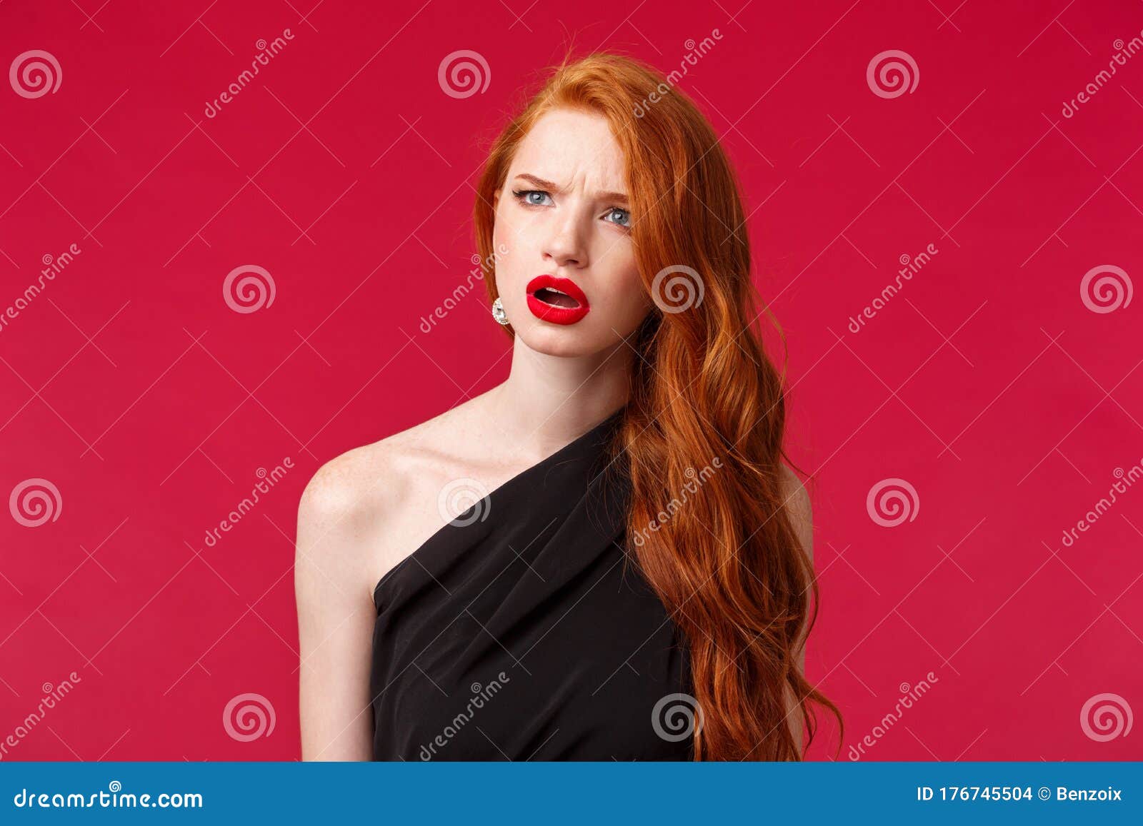 Close Up Portrait Of Perplexed And Confused Young Redhead Woman Seeing