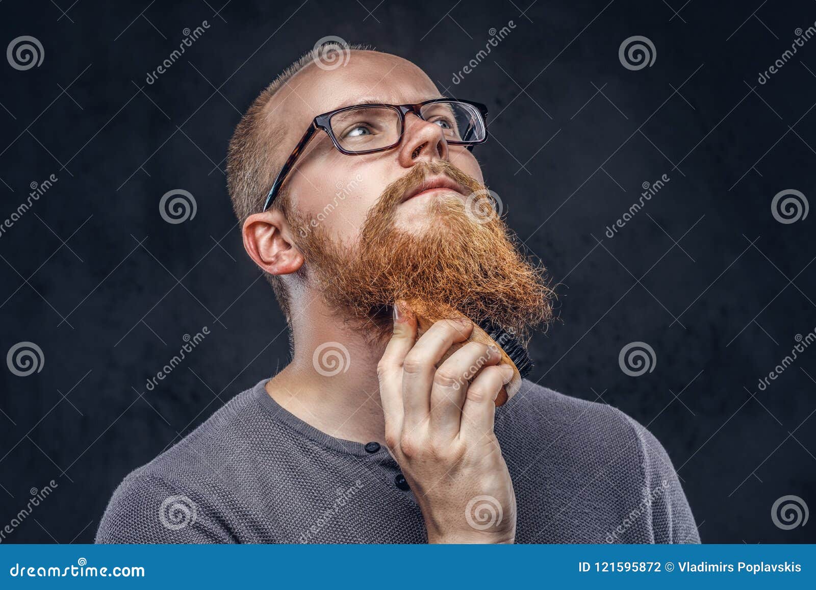 Close Up Portrait Of A Redhead Bearded Male Wearing Glasses Dressed In