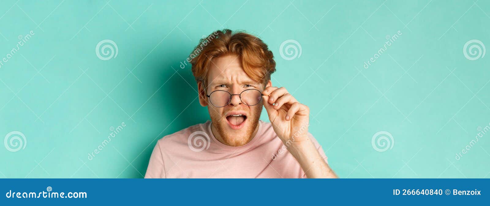 Close Up Portrait Of Redhead Guy Take Off Glasses And Looking Confused