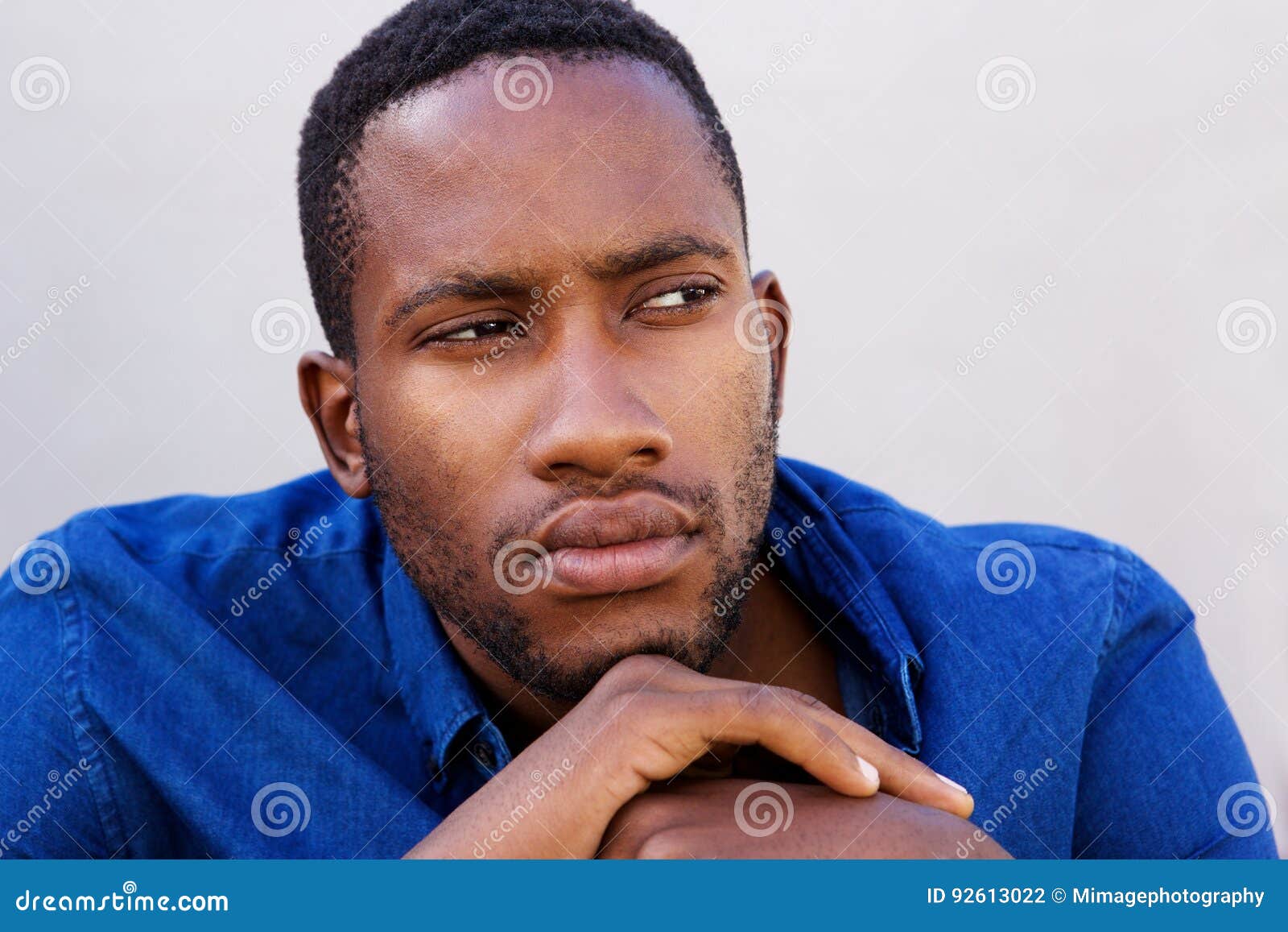Serious Young African Man Looking Away and Thinking Stock Photo - Image ... Serious Young African Man Looking Away and Thinking Stock Photo - Image ...