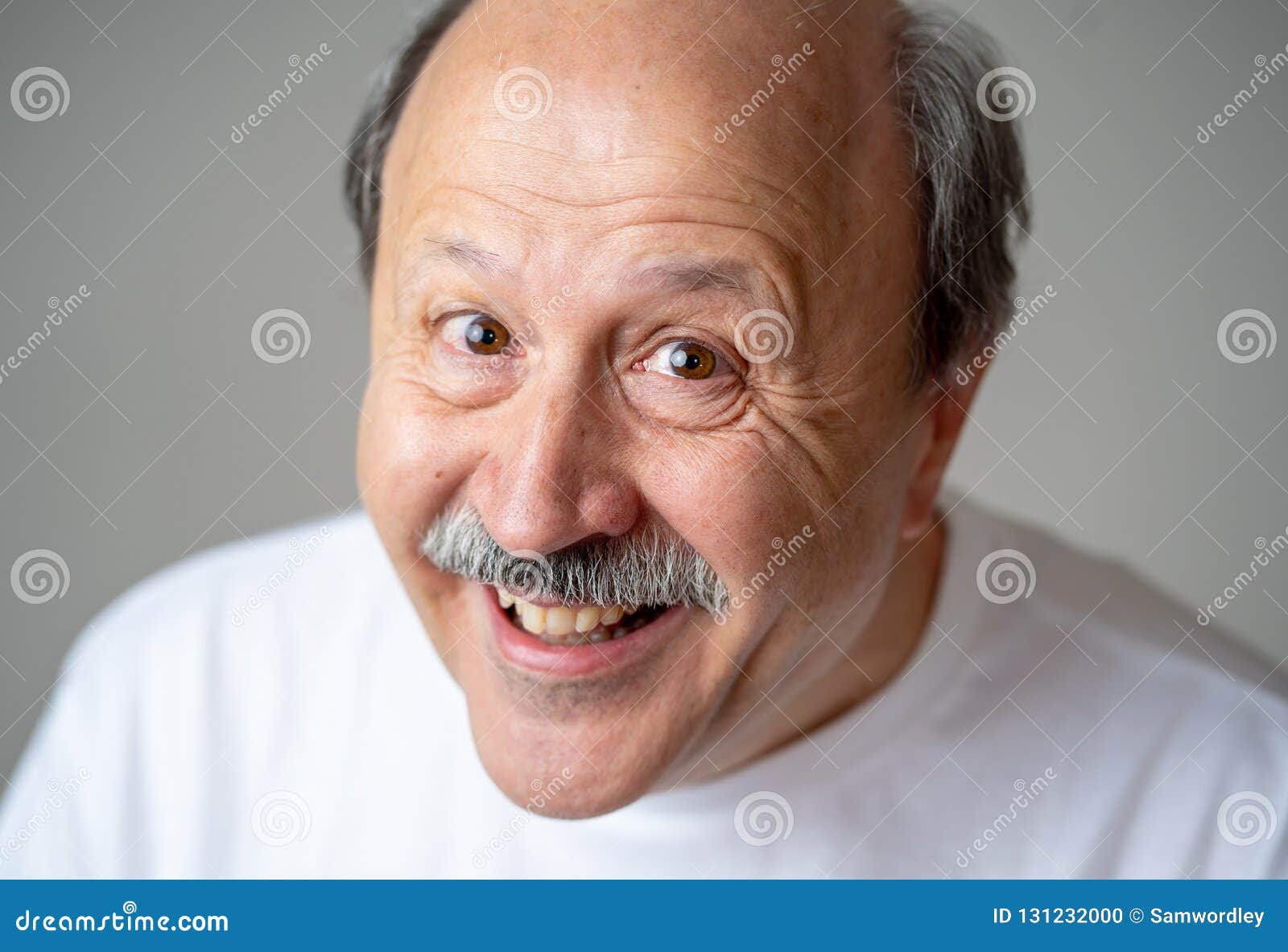 Close Up Portrait Of Smiling Senior Man With Happy Face Looking At The