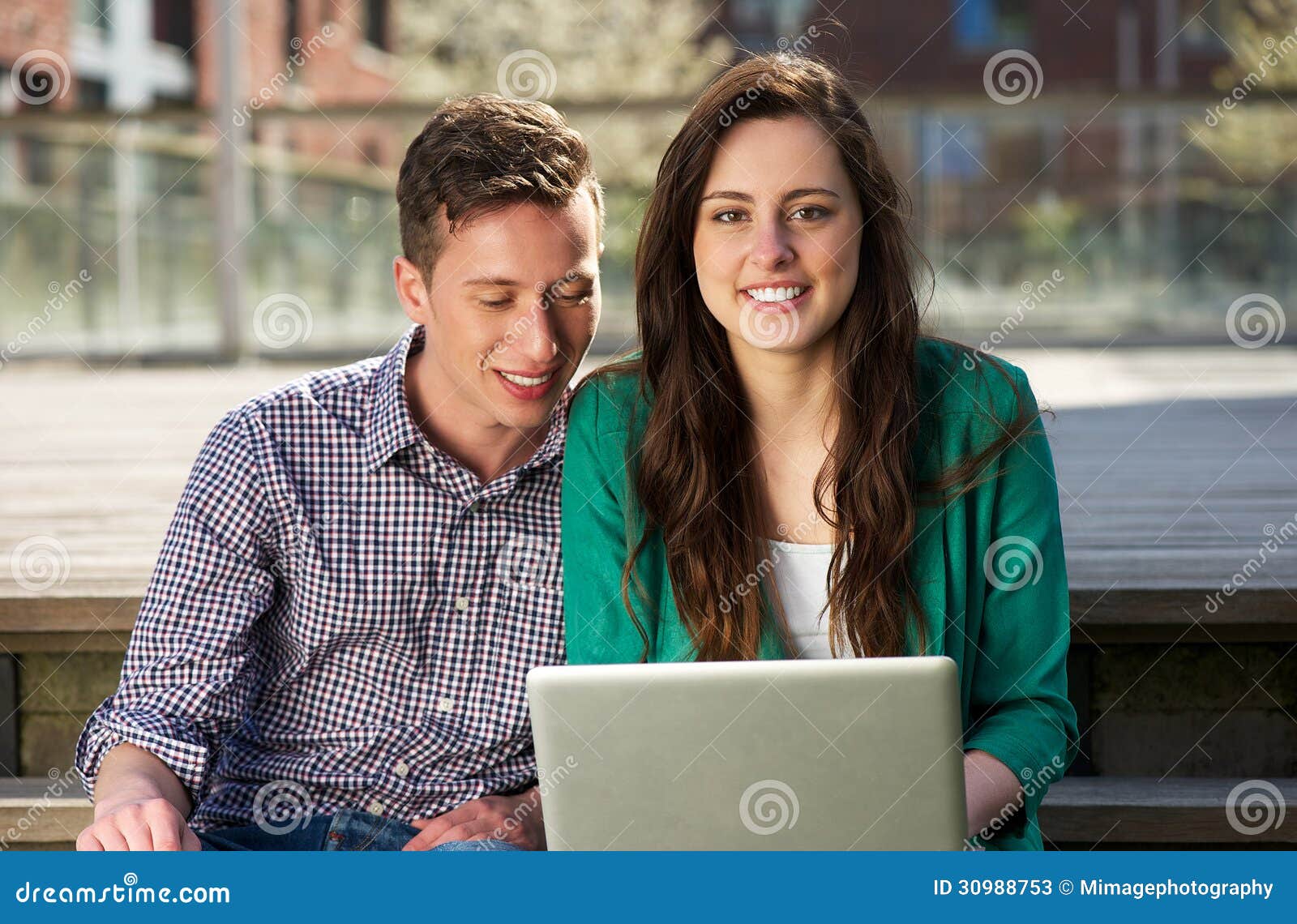 Close Up Portrait of Two College Students Working on Laptop Outdoors ...