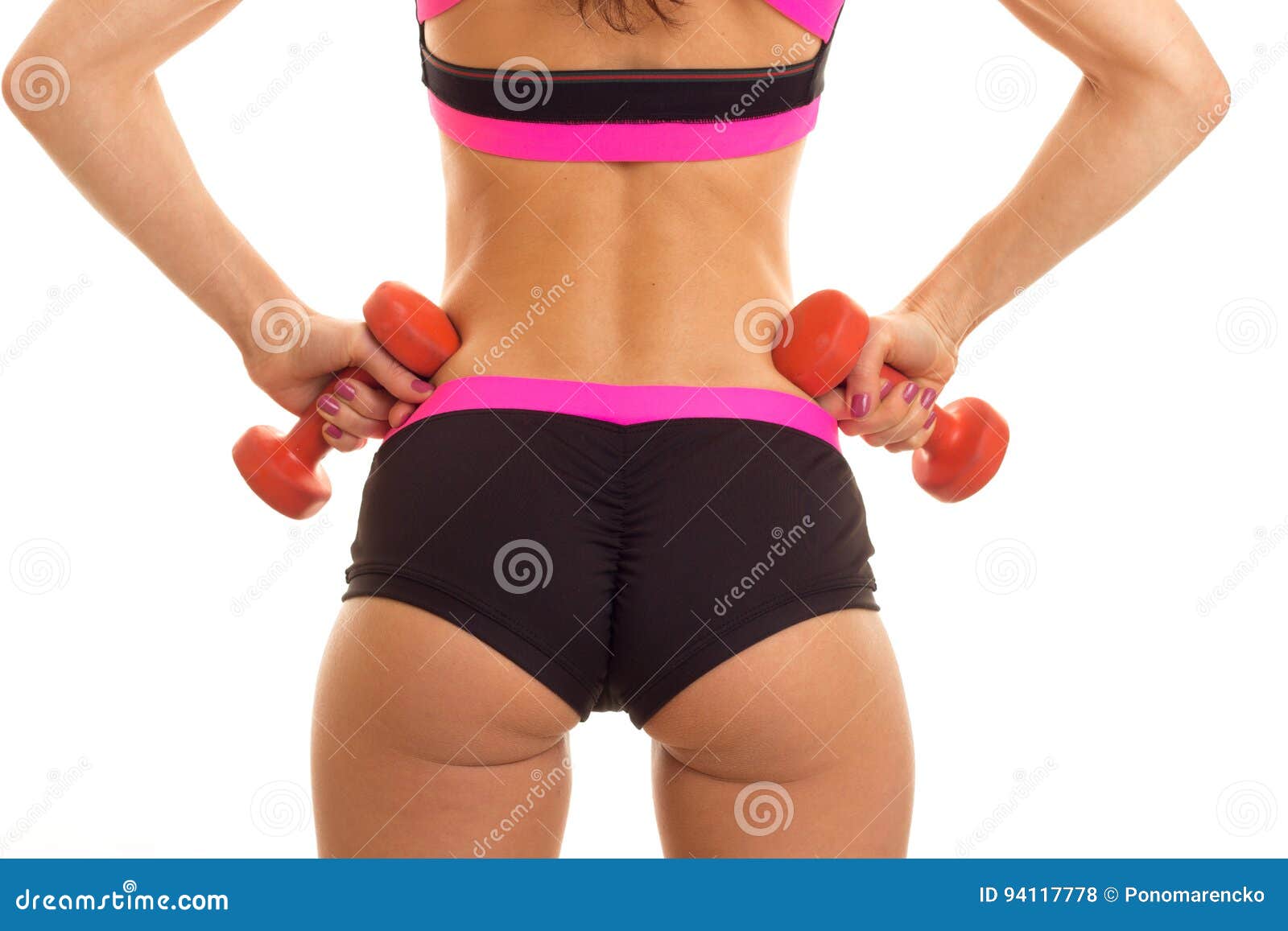 A Close Up Portrait Of Women`s Sports Round Buttocks In Short Shorts