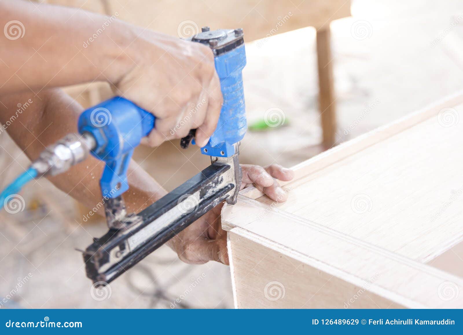 Worker at Carpenter Workspace Installing Nail Using Pneumatic Na Stock ...