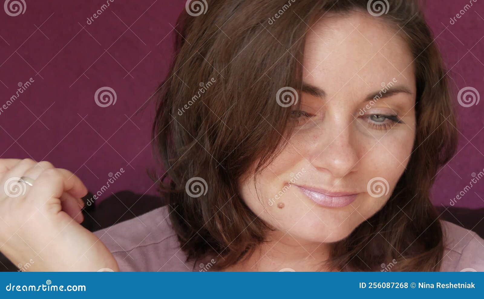 Close Up Portrait Of A Young Beautiful Woman With Green Eyes And Dark