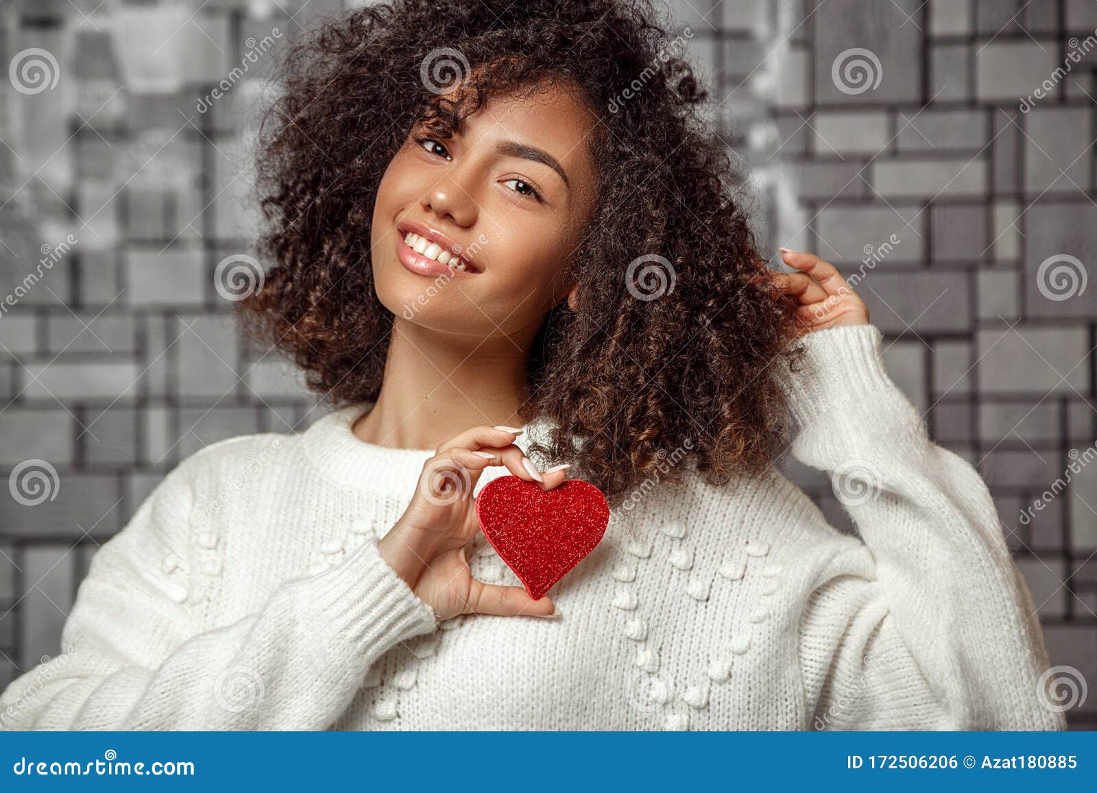 Close Up Portrait Of A Young Curly Haired African American Girl In A