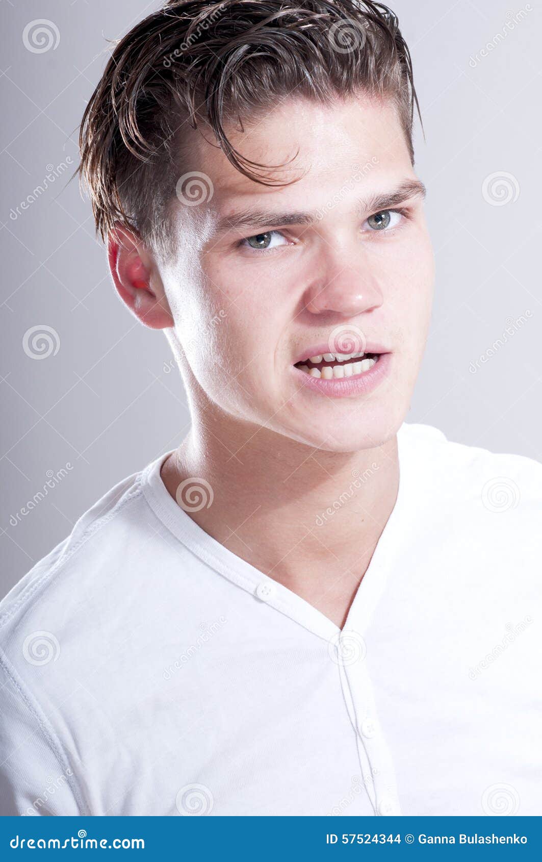 Close-up Portrait of Young Man Grimacing. Stock Photo - Image of ...