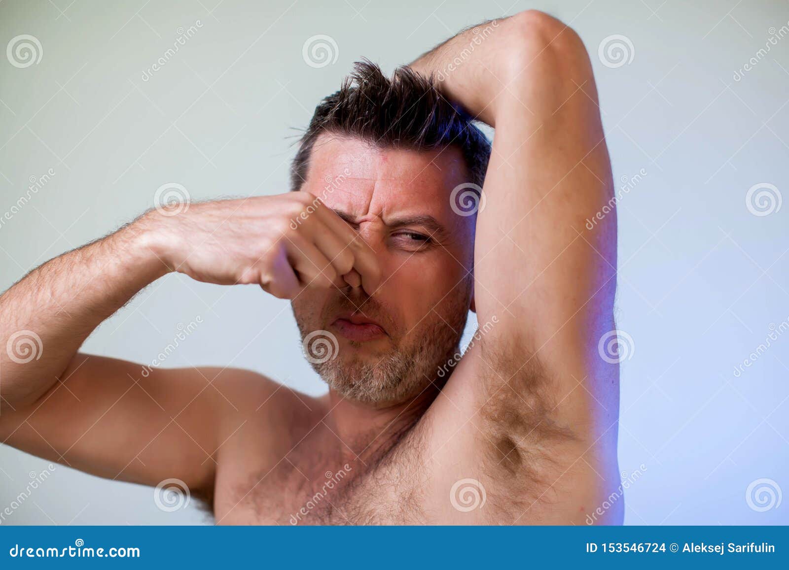 Close Up Portrait Of Man Smelling His Armpit Feeling Bad Odor Wants To Take A Shower Needs 7390