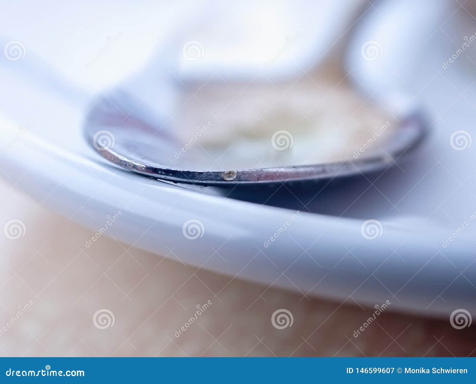 Front Edge of a Small Spoon on a Small Plate Stock Image - Image of ...