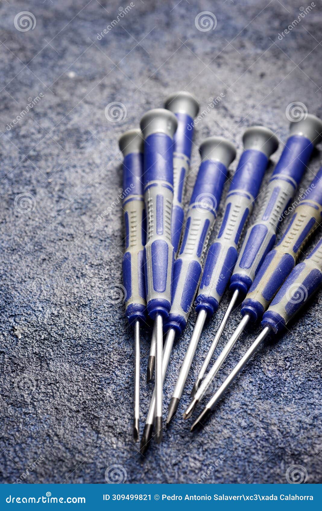 Metal Precision Screwdriver Group on a Blue Table Stock Image - Image ...