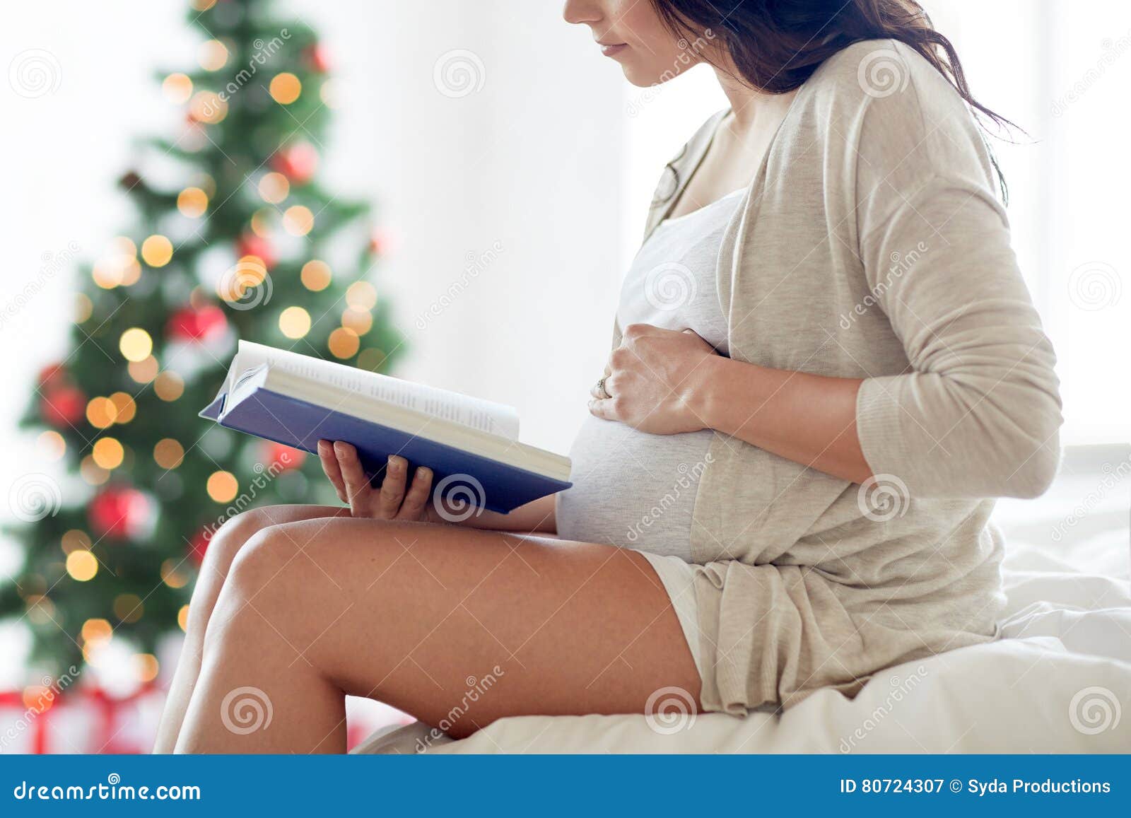 Close Up Of Pregnant Woman Reading Book At Home Stock Image Image Of