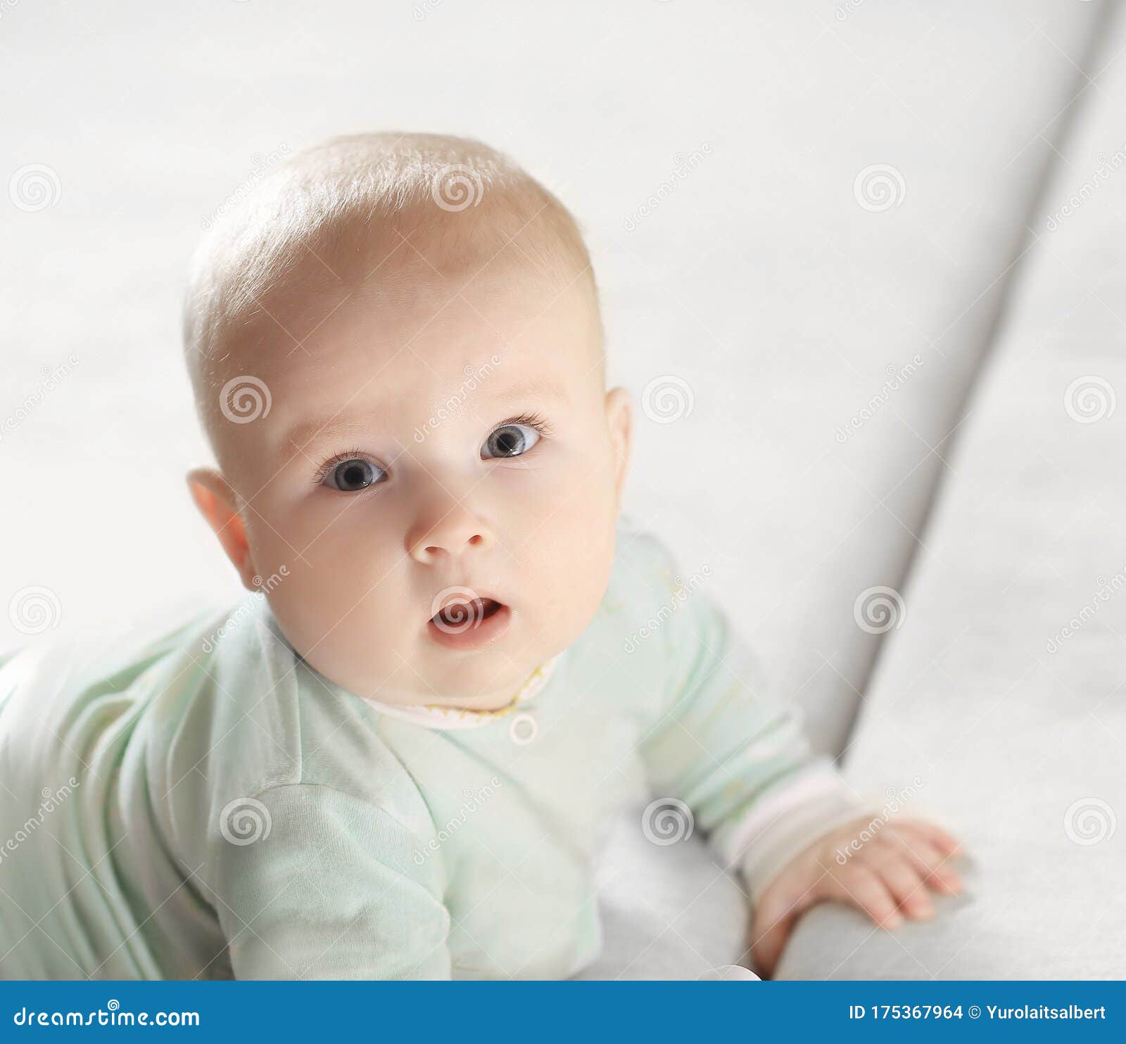 Close-up of a Pretty Little Baby Looking at the Camera.photo Wit Stock ...