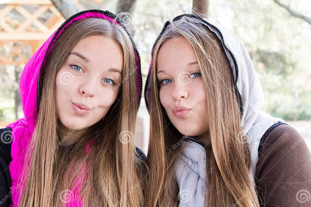 Close-up of pretty twins stock image. Image of friendship - 27326225