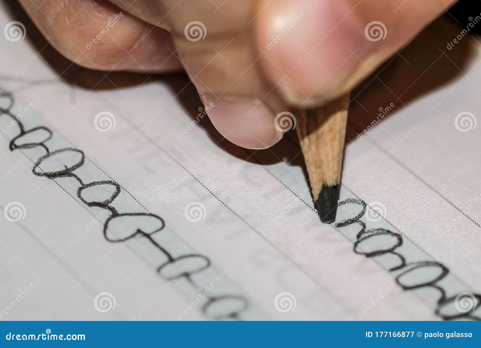 Close Up of Primary School Kid Doing Homework on Letter Write Excercise ...