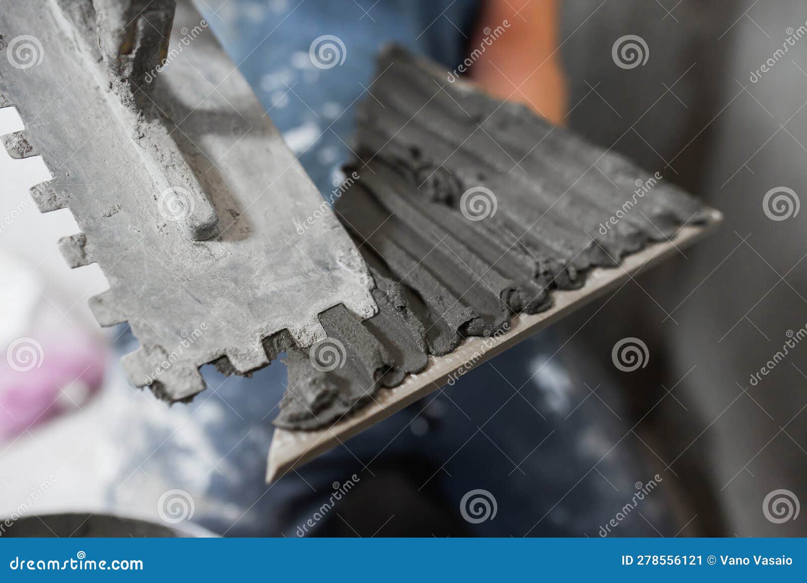 Close-up of the Process of Installing Tiles on the Floor and Wall Stock ...