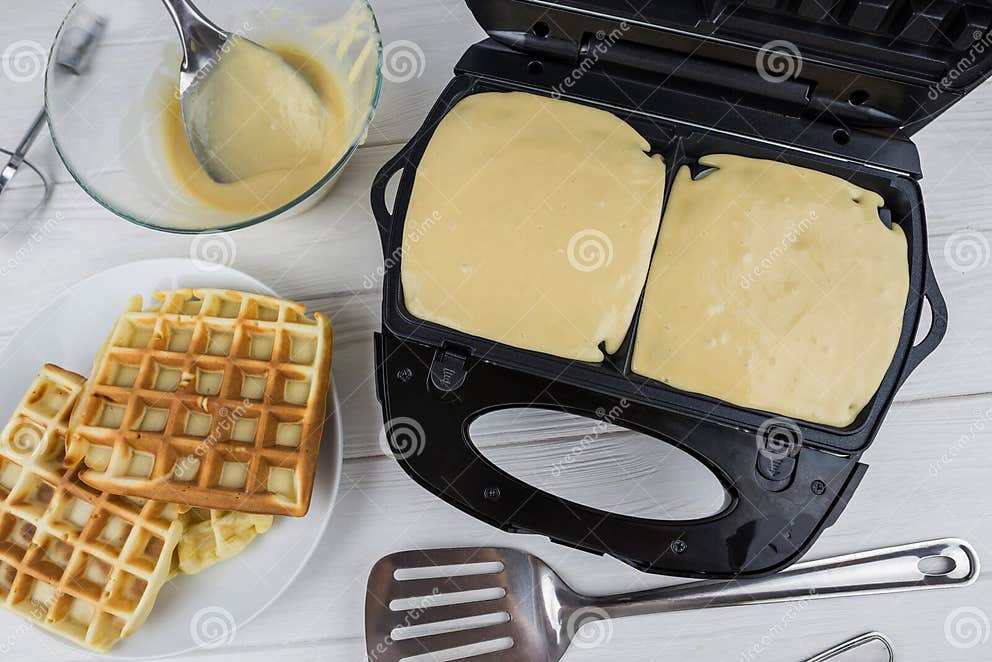 Close-up of the Process of Making Belgian Waffles in a Waffle Iron at ...