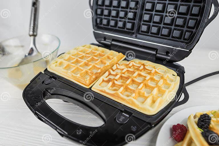 Close-up of the Process of Making Belgian Waffles in a Waffle Iron at ...