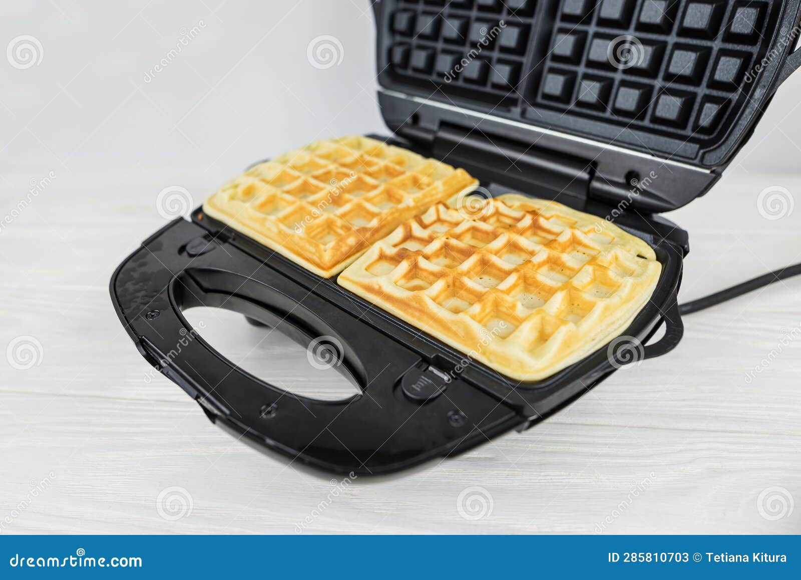 Close-up of the Process of Making Belgian Waffles in a Waffle Iron at ...