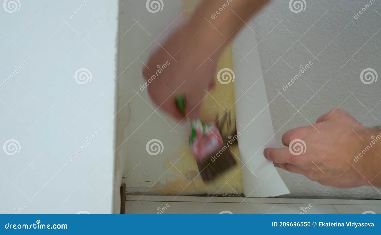 Close-up, the Process of Wallpapering. Male Hands Paste Wallpaper on ...