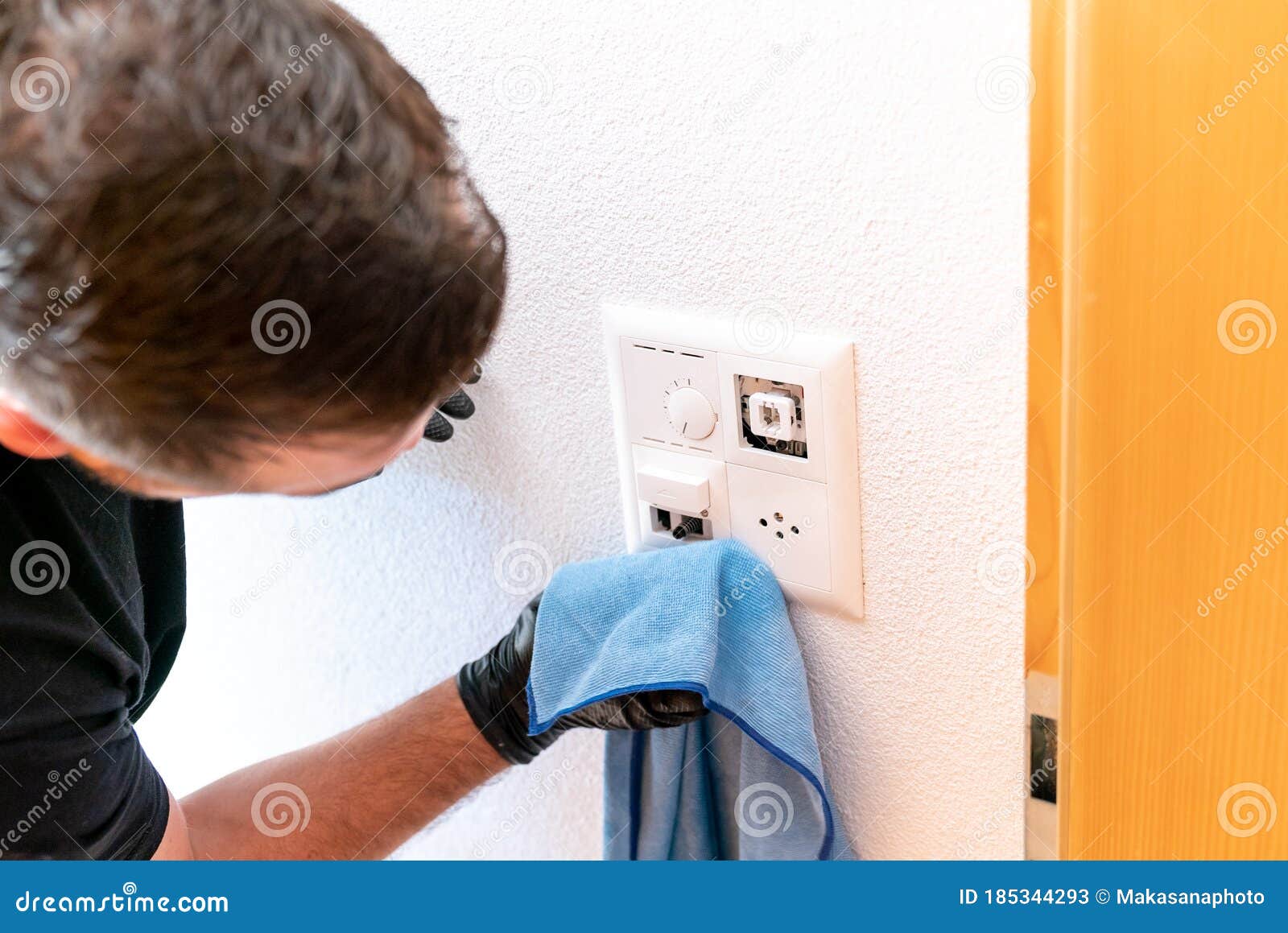 Close Up of a Professional Cleaner Cleaning a Modern Light Switch and ...