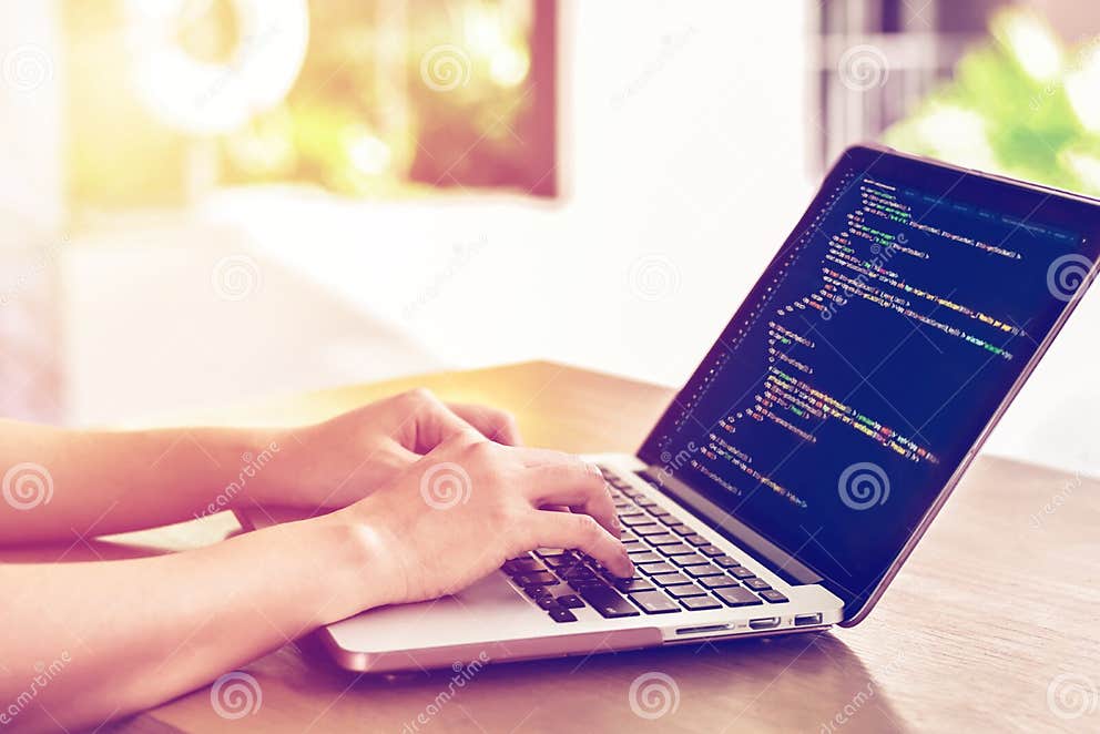 Close-up of Programmer`s Hands Working on Source Codes Over a Laptop ...