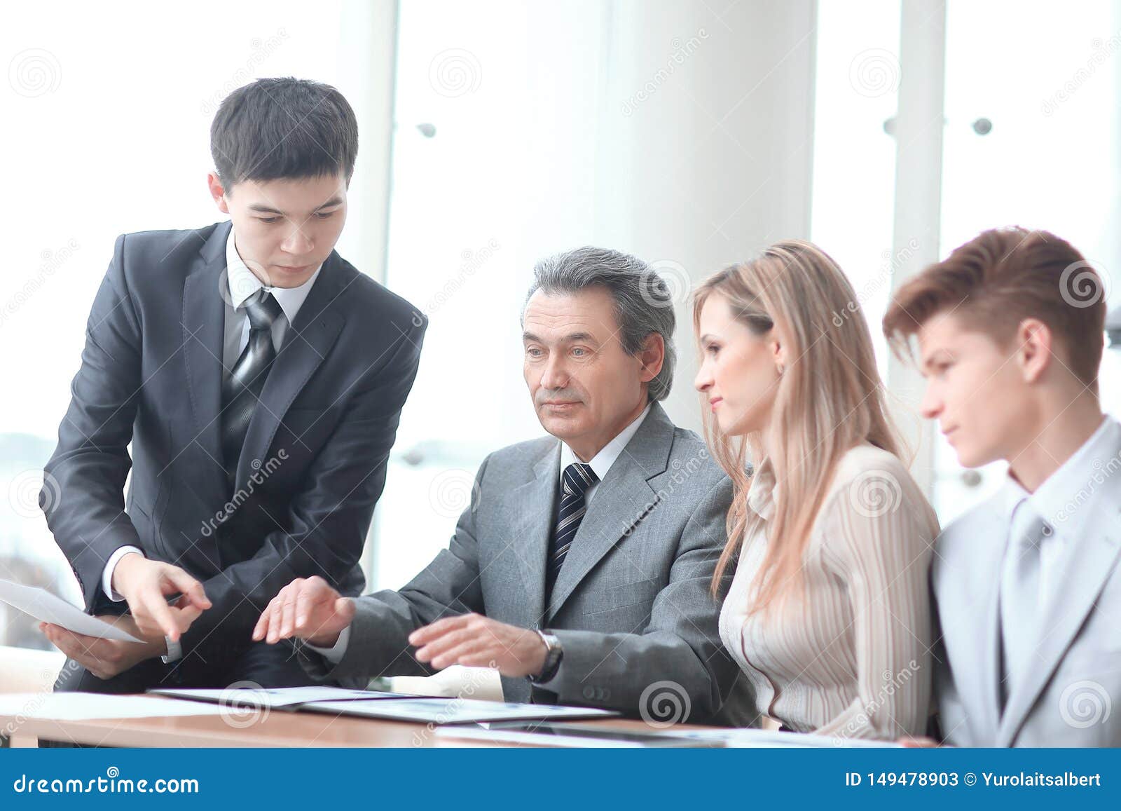 Close Up.project Manager and Business Team at a Desk in the Office ...