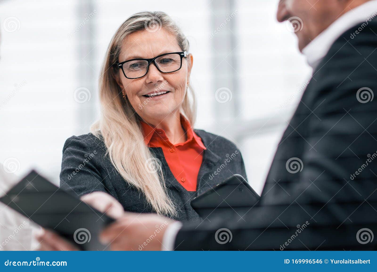 Close Up. Project Manager Discussing with Employees Working Documents ... Close Up. Project Manager Discussing with Employees Working Documents ...
