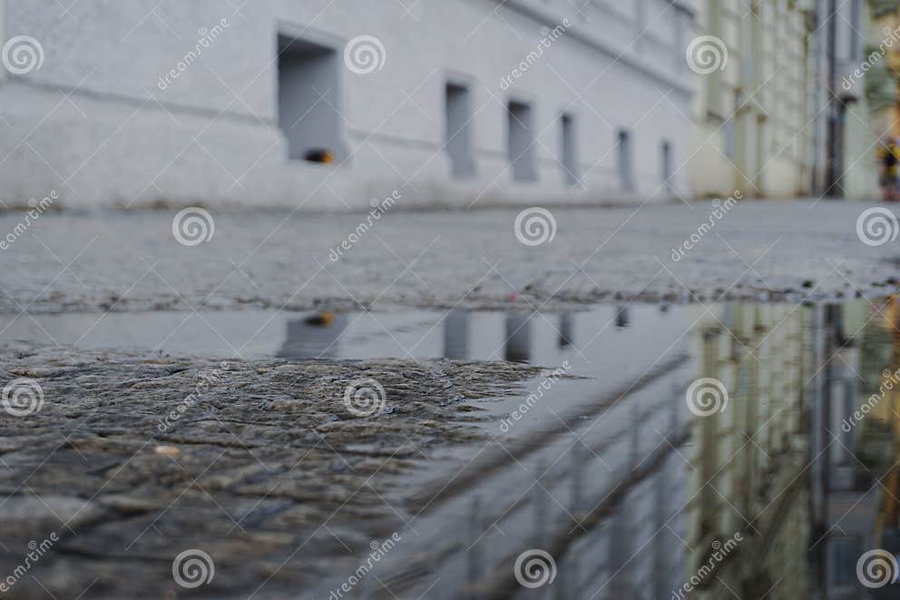 Close Up of a Puddle in Front of a Building Stock Image - Image of ...