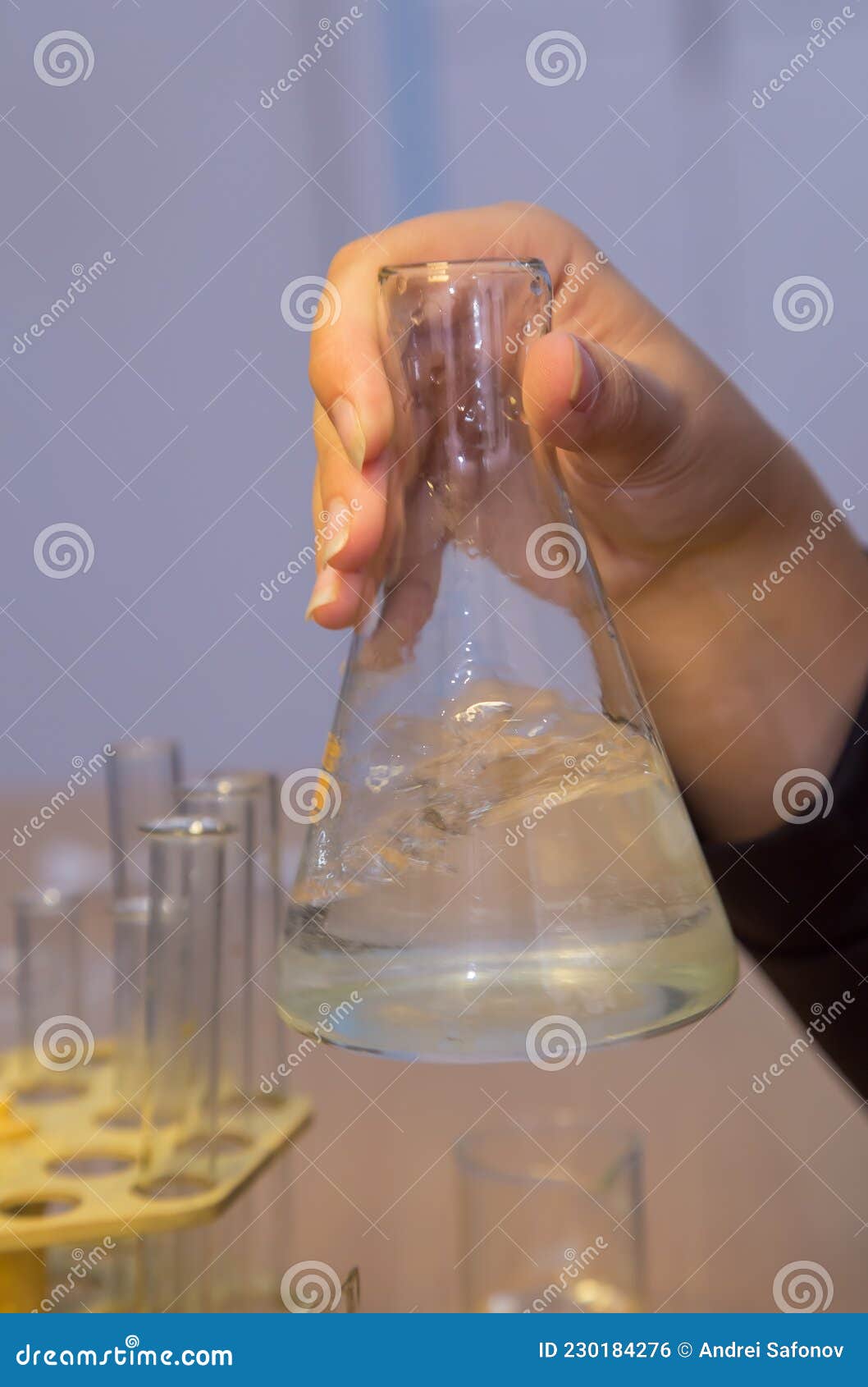 Close-up Pupil& X27;s Hands are Shaking a Flask with a Chemical ...
